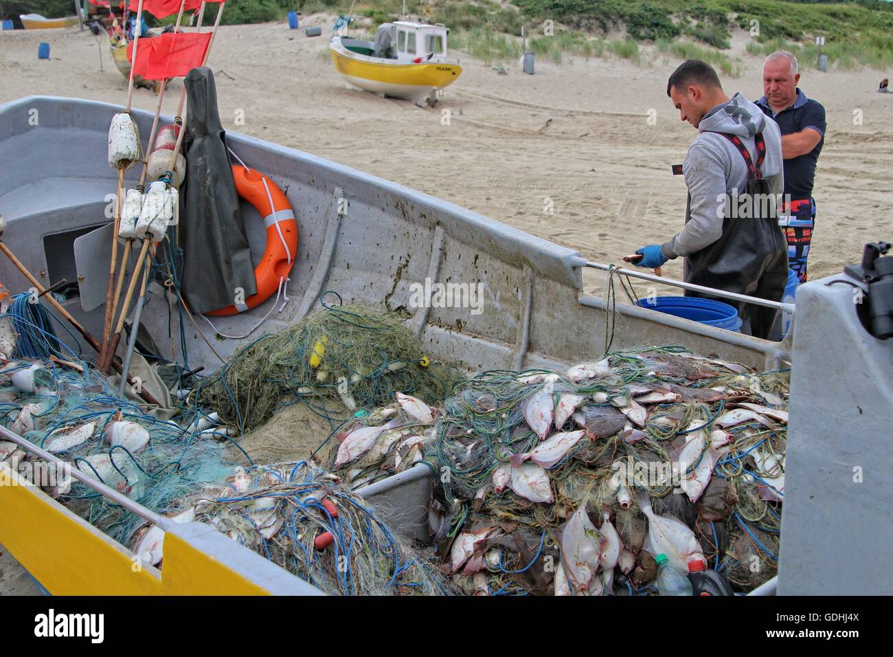 Piaski, Poland 17th, July 2016 Fishermen in Piaski return from the ...