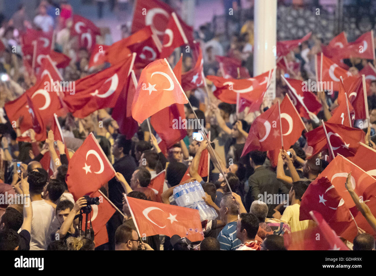 Istanbul, Turkey. 17th July, 2017. People shout slogans and hold flags ...