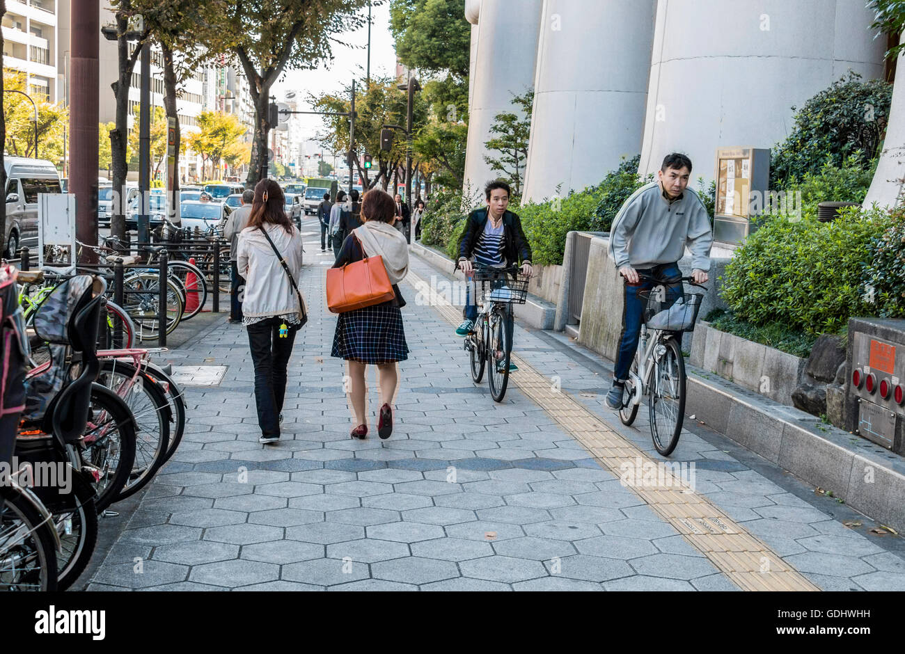 Cycling in the city of Osaka Japan along one of the many cycle paths ...