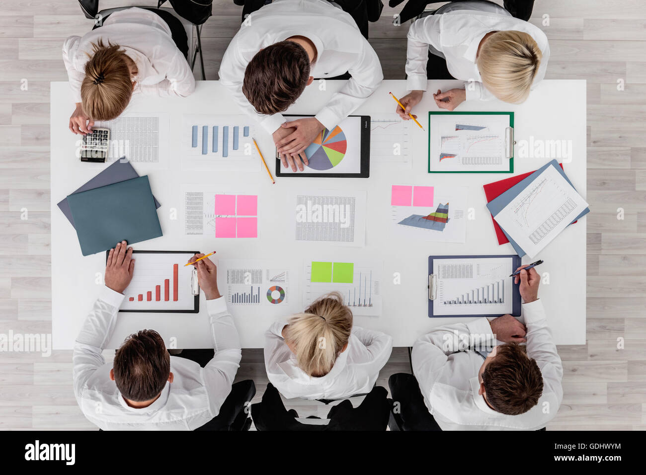 Business team discussing financial charts hi-res stock photography and ...