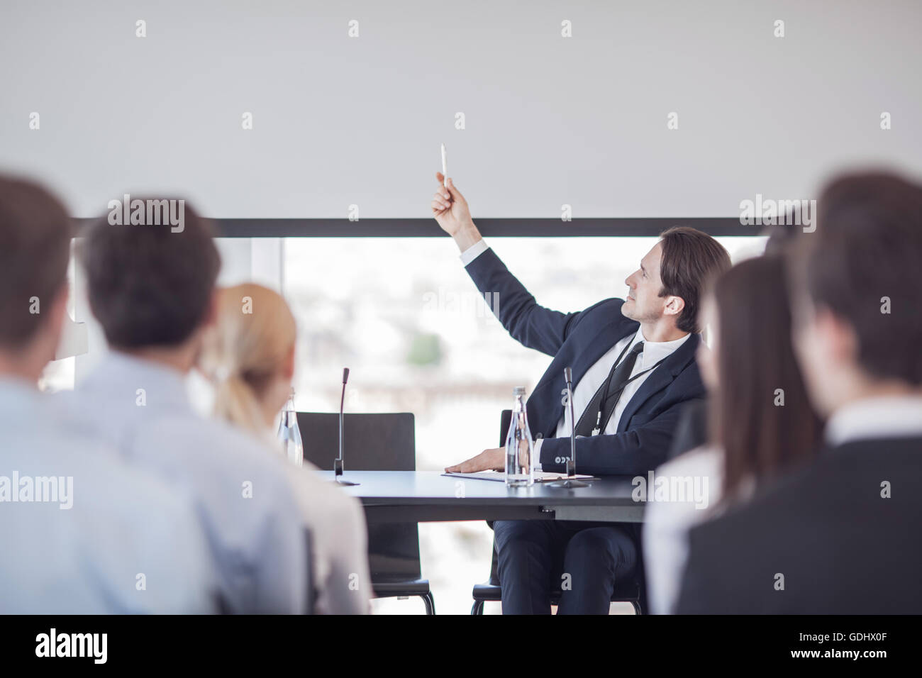 Speaker talking and showing presentation to audience in the conference ...