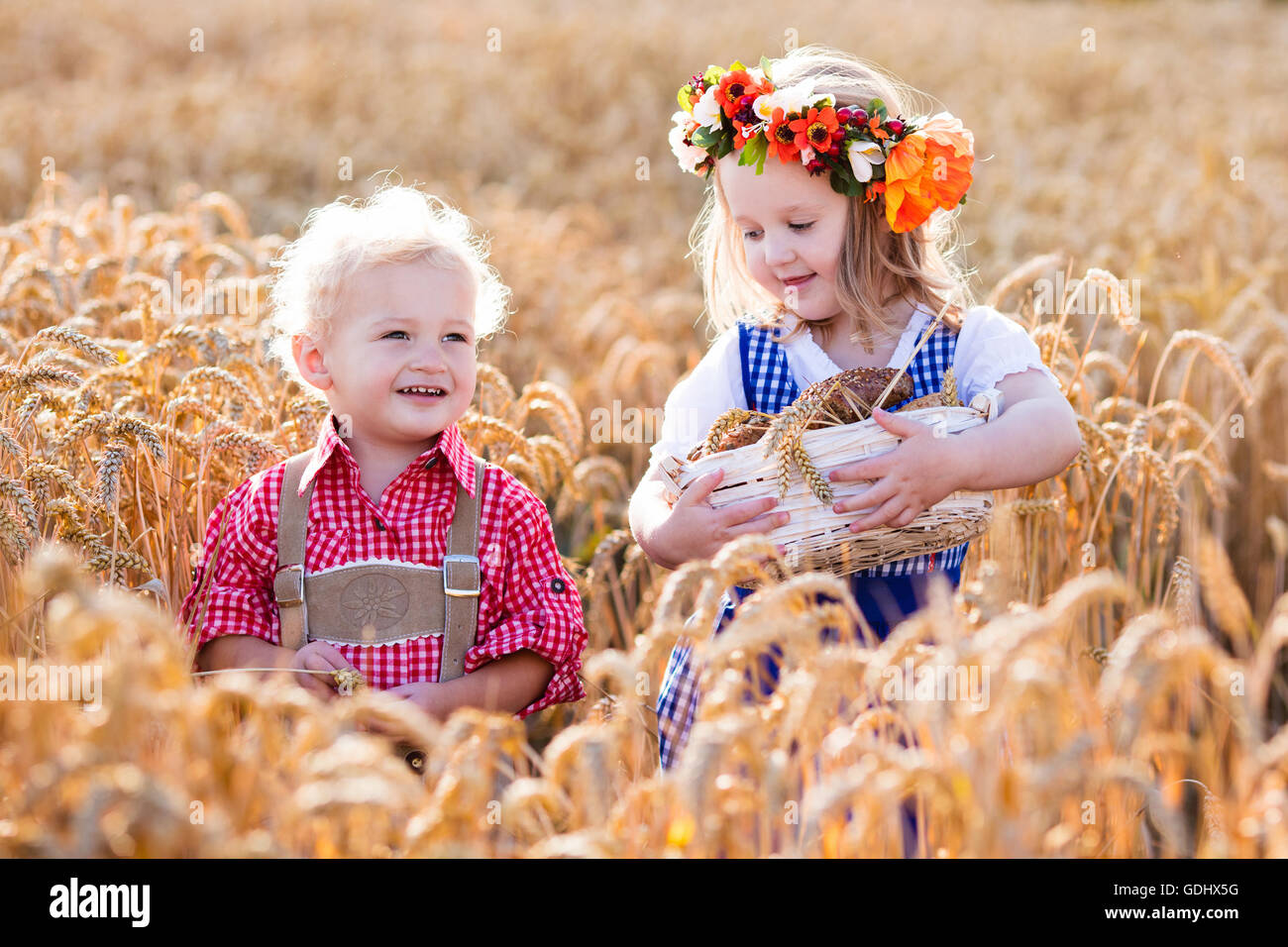 Kids in traditional Bavarian costumes in wheat field. German children ...