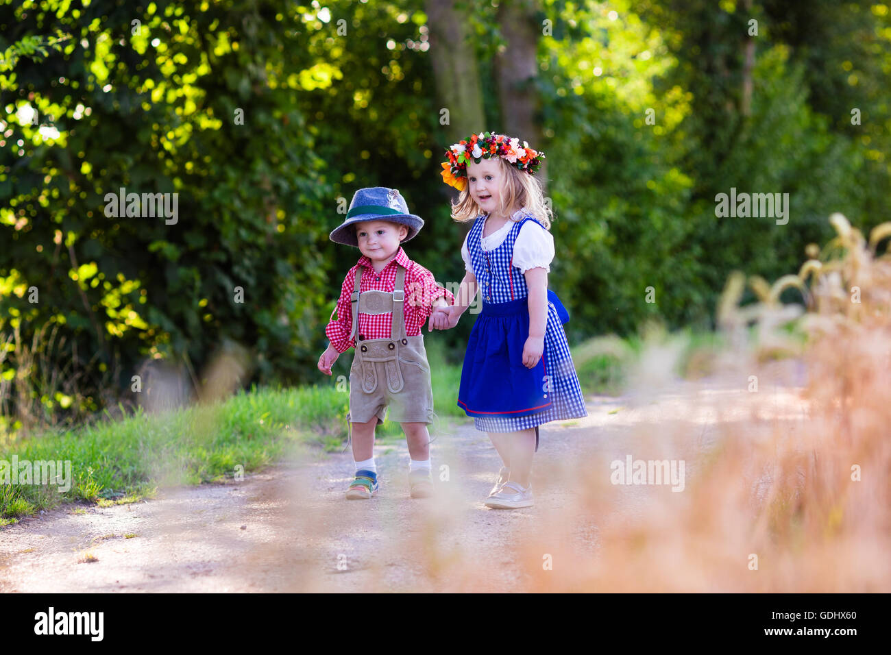 Kids in traditional Bavarian costumes in wheat field. German children ...