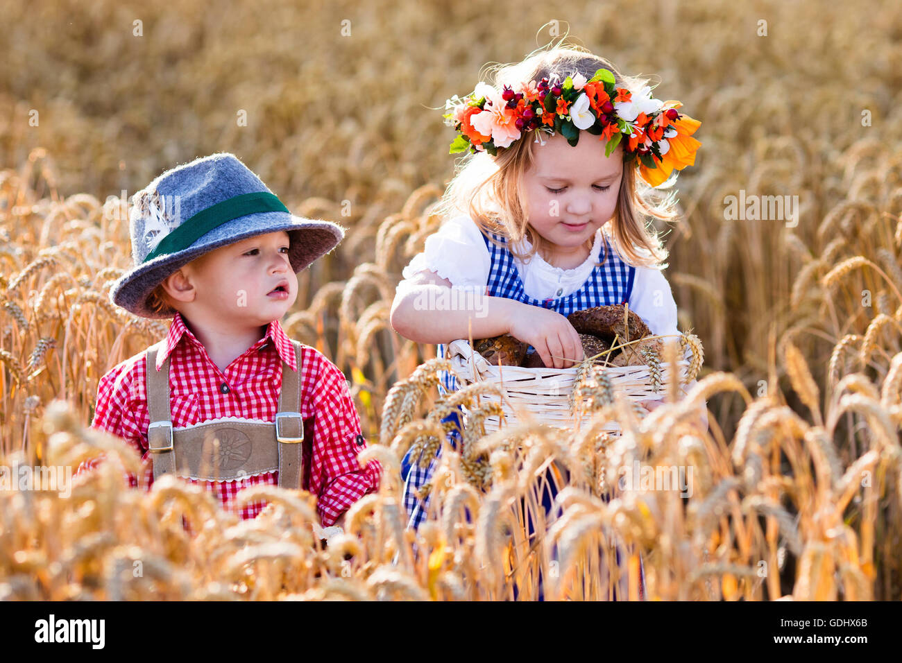 Kids in traditional Bavarian costumes in wheat field. German children ...