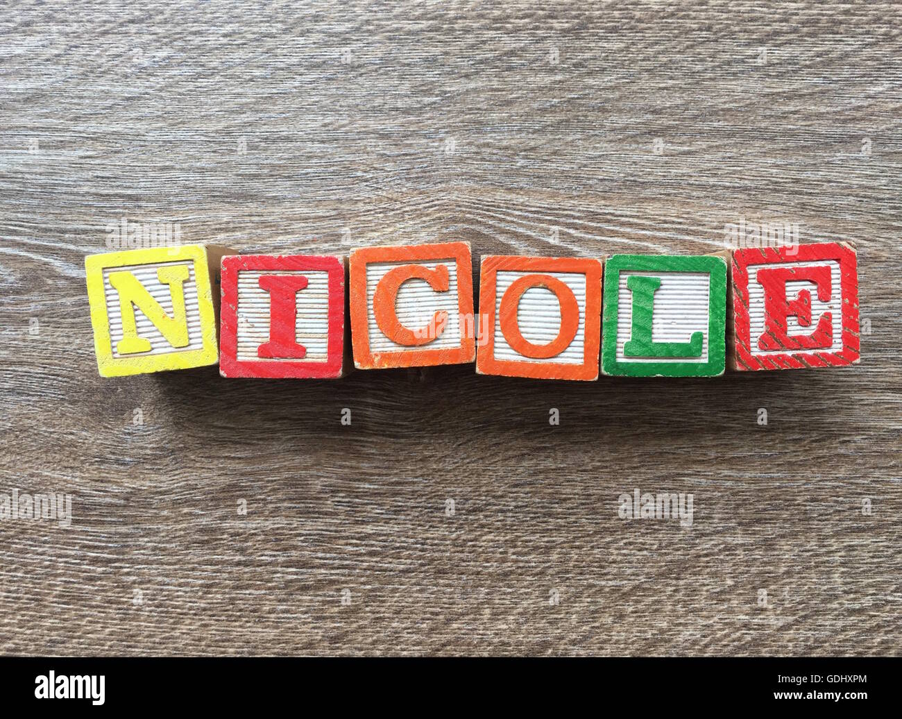 Nicole name written with wood block letter toys Stock Photo - Alamy