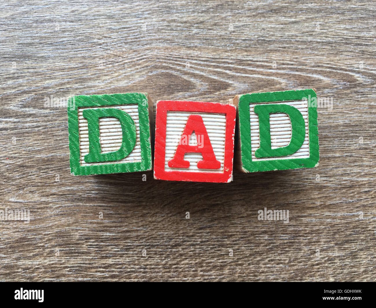 DAD word written with wood block letter toys Stock Photo - Alamy