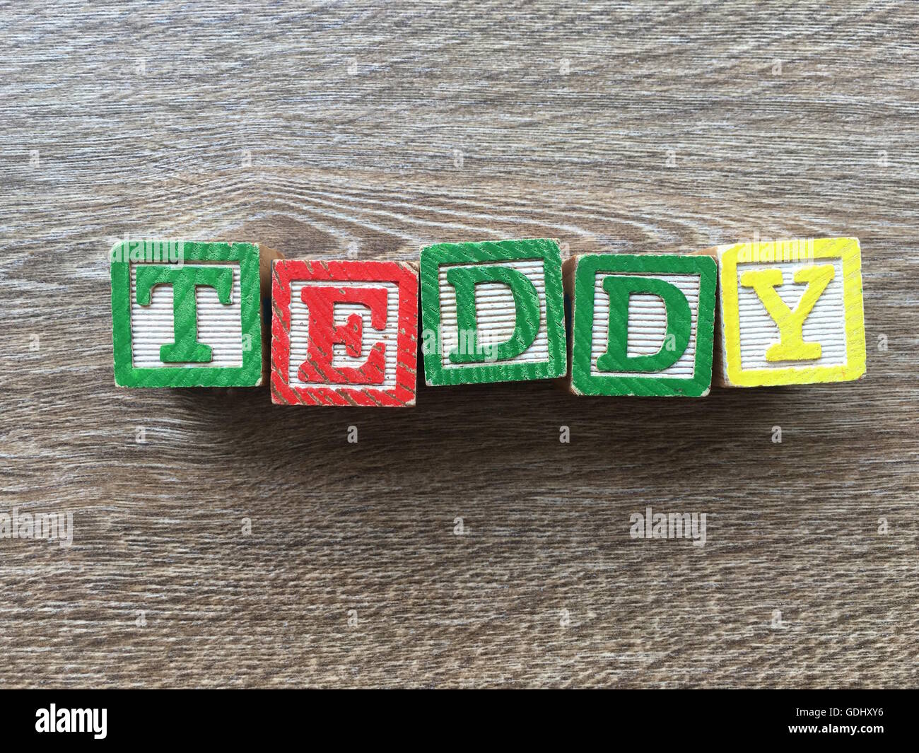 Teddy name written with wood block letter toys Stock Photo Alamy