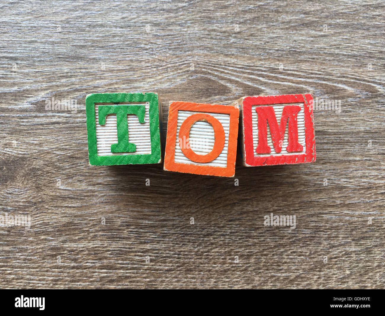 Tom name written with wood block letter toys Stock Photo - Alamy