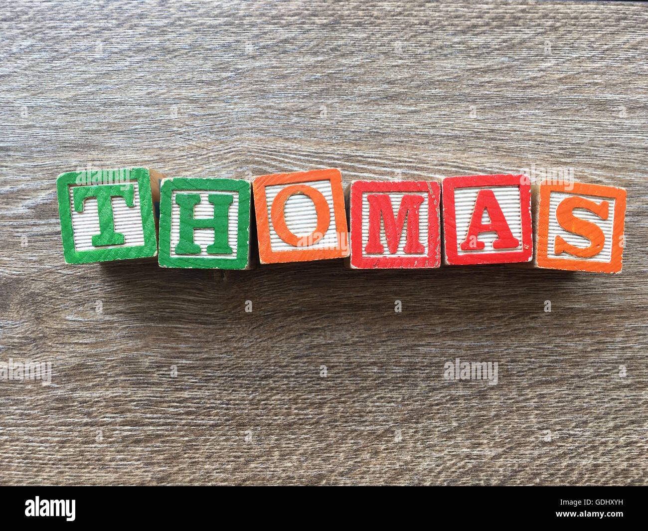 Thomas name written with wood block letter toys Stock Photo - Alamy