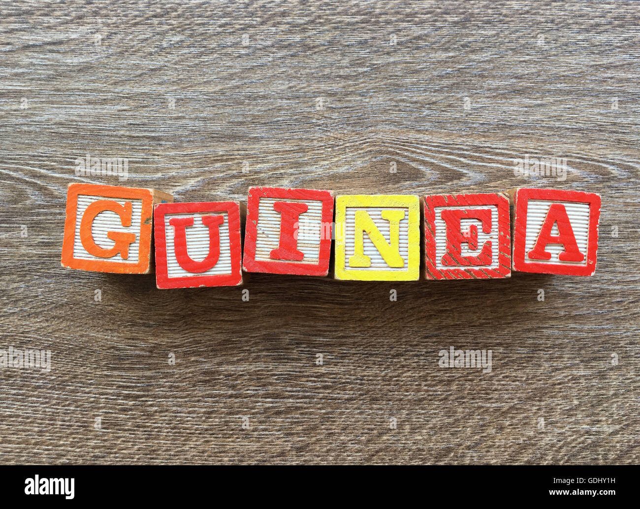 GUINEA word written with wood block letter toys Stock Photo - Alamy