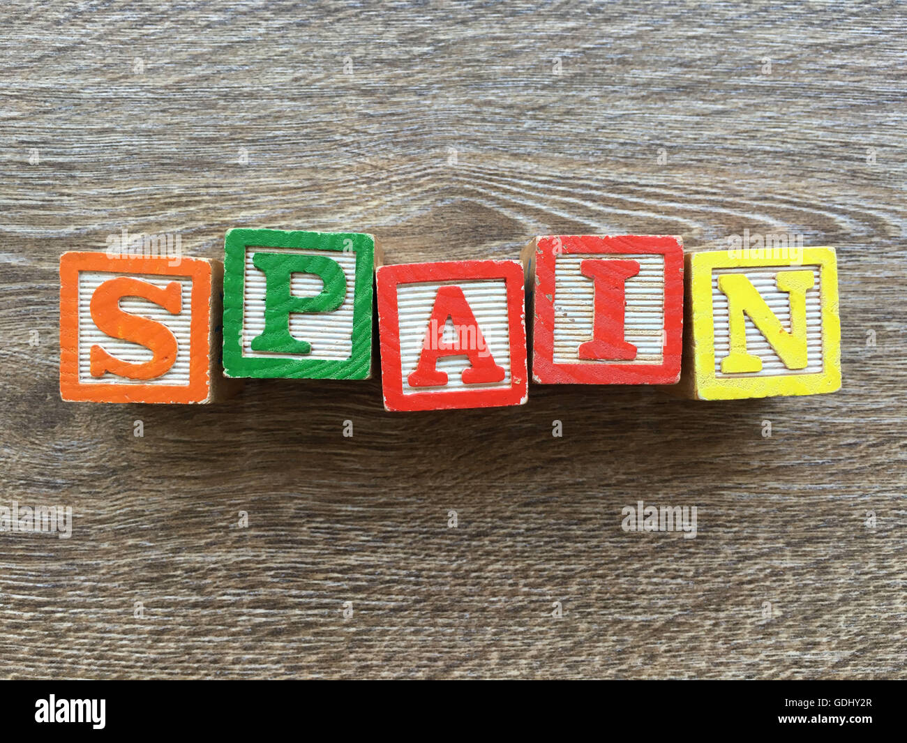 SPAIN word written with wood block letter toys Stock Photo - Alamy