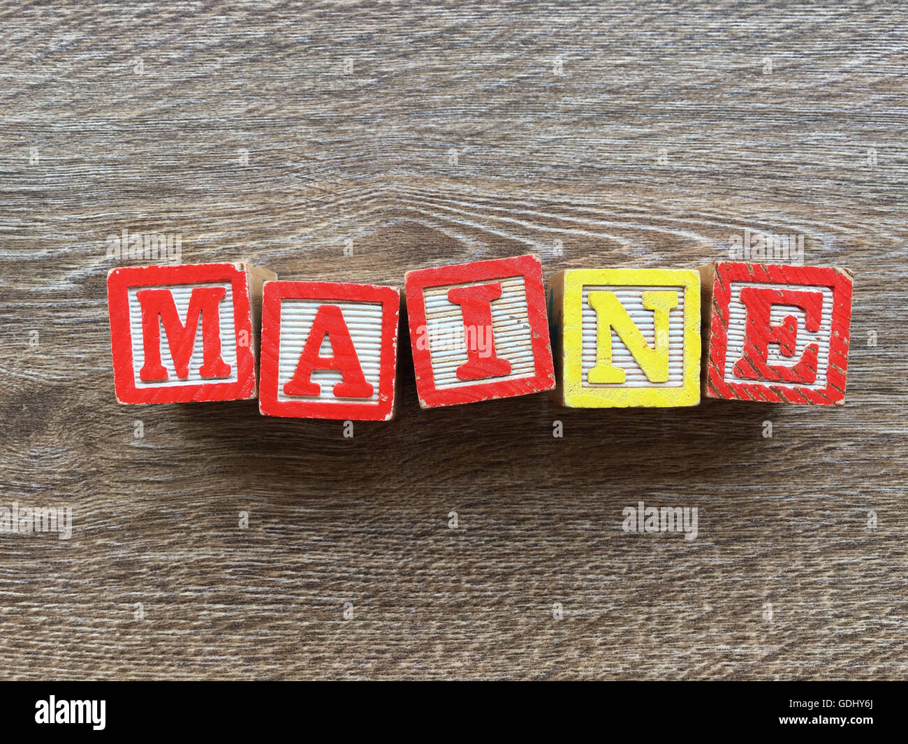 MAINE word written with alphabet wood block letter toys Stock Photo - Alamy