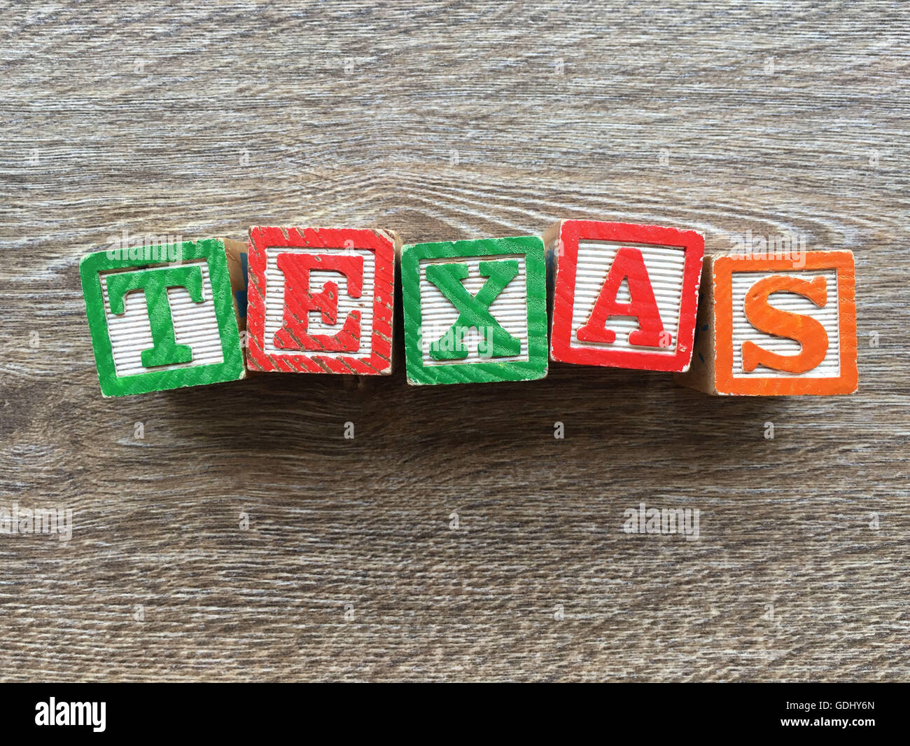 TEXAS word written with alphabet wood block letter toys Stock Photo - Alamy