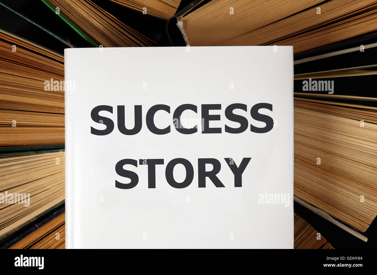 Top view of Success Story book with old hardback books background Stock ...