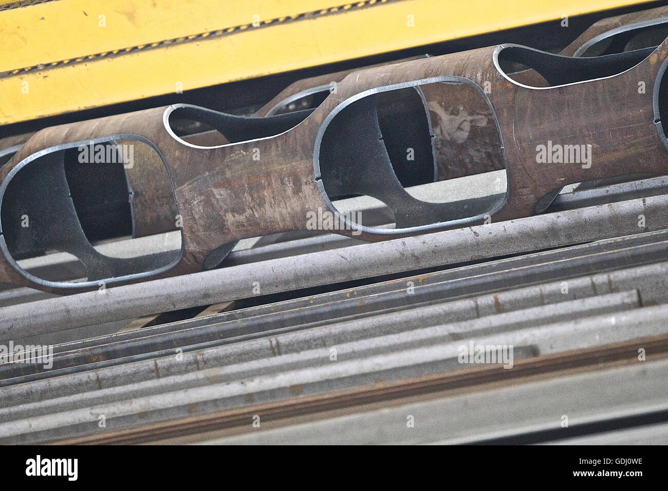 Pipe with oval holes as part of metal structures Stock Photo - Alamy