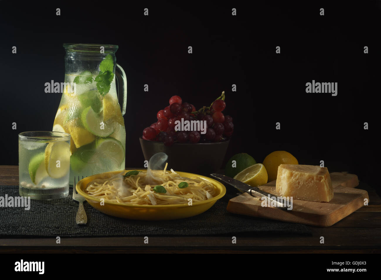 Still life with pasta on dark background Stock Photo - Alamy