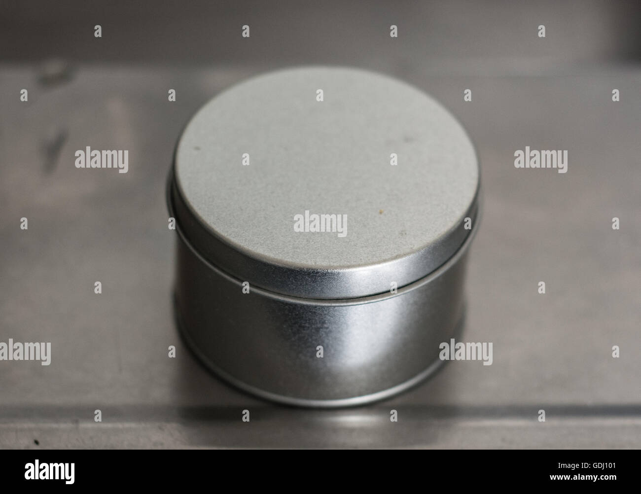 Small circular metal can Stock Photo - Alamy