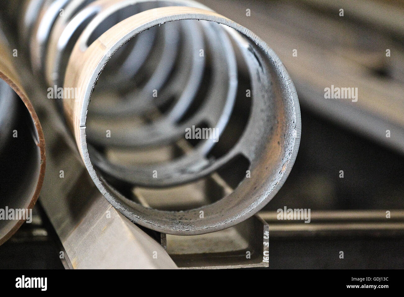 Pipe with oval holes as part of metal structures Stock Photo - Alamy