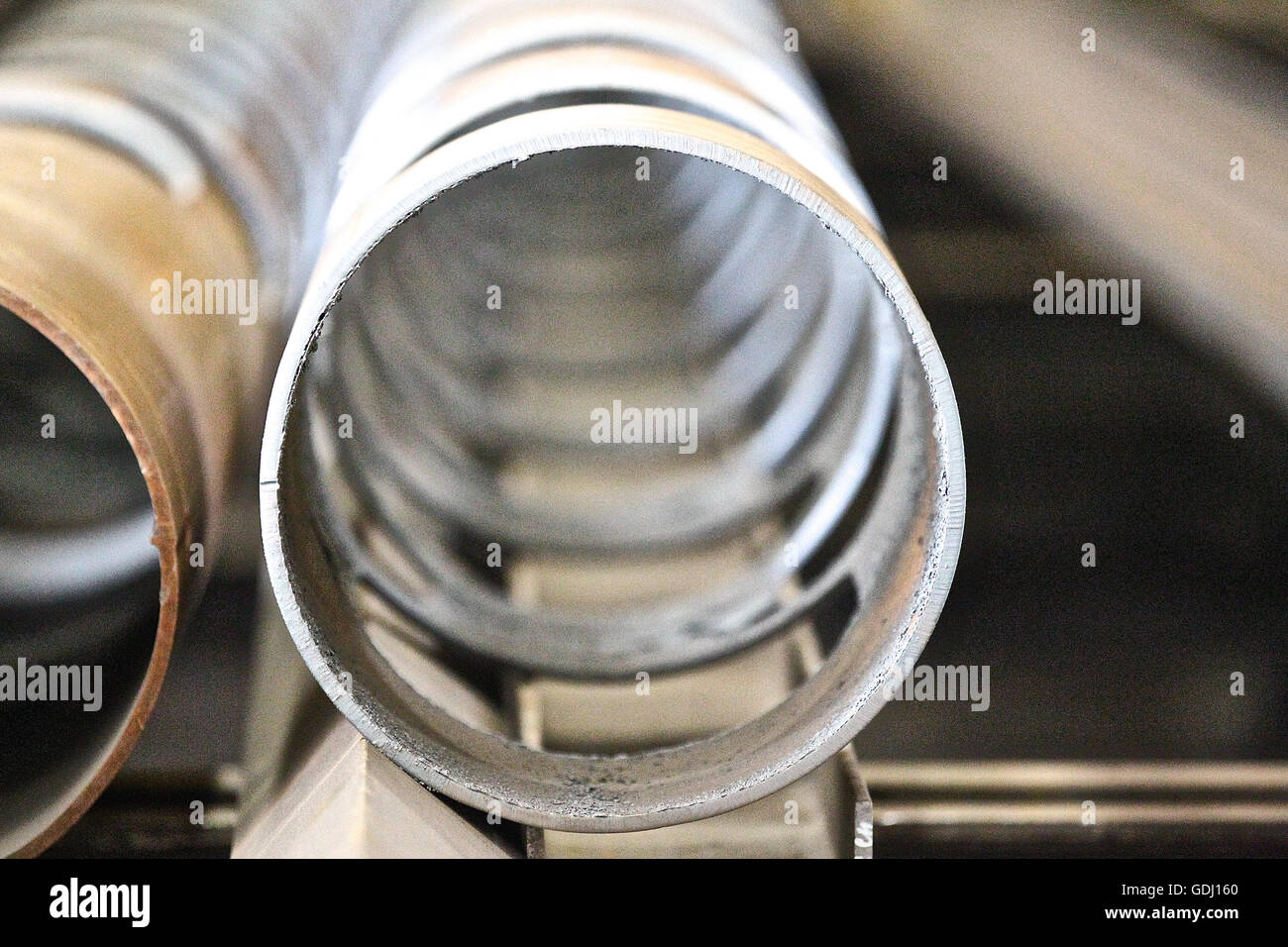 Pipe with oval holes as part of metal structures Stock Photo - Alamy