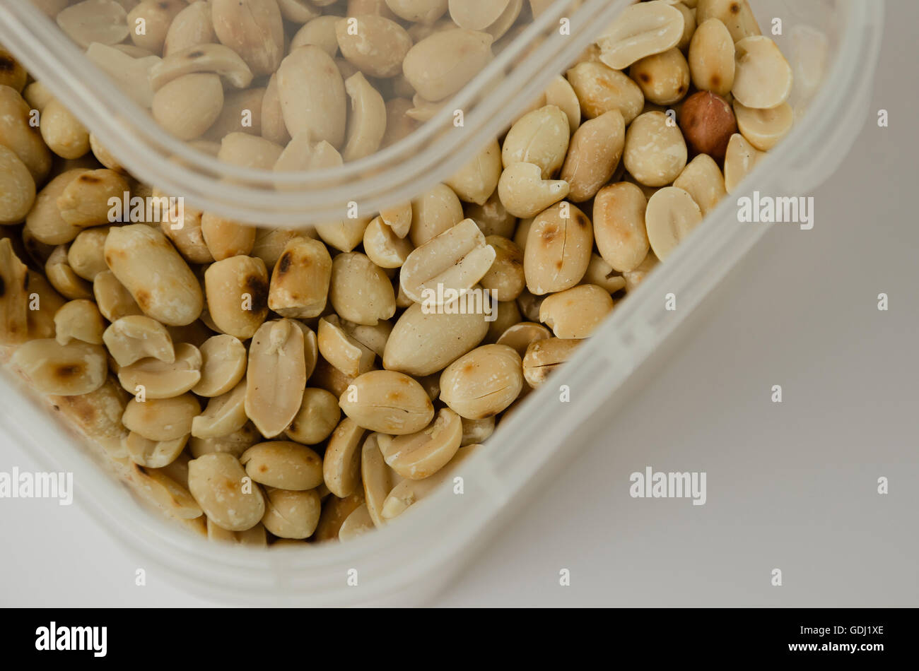 Peanut In Plastic Box Container On White Background Stock Photo - Alamy