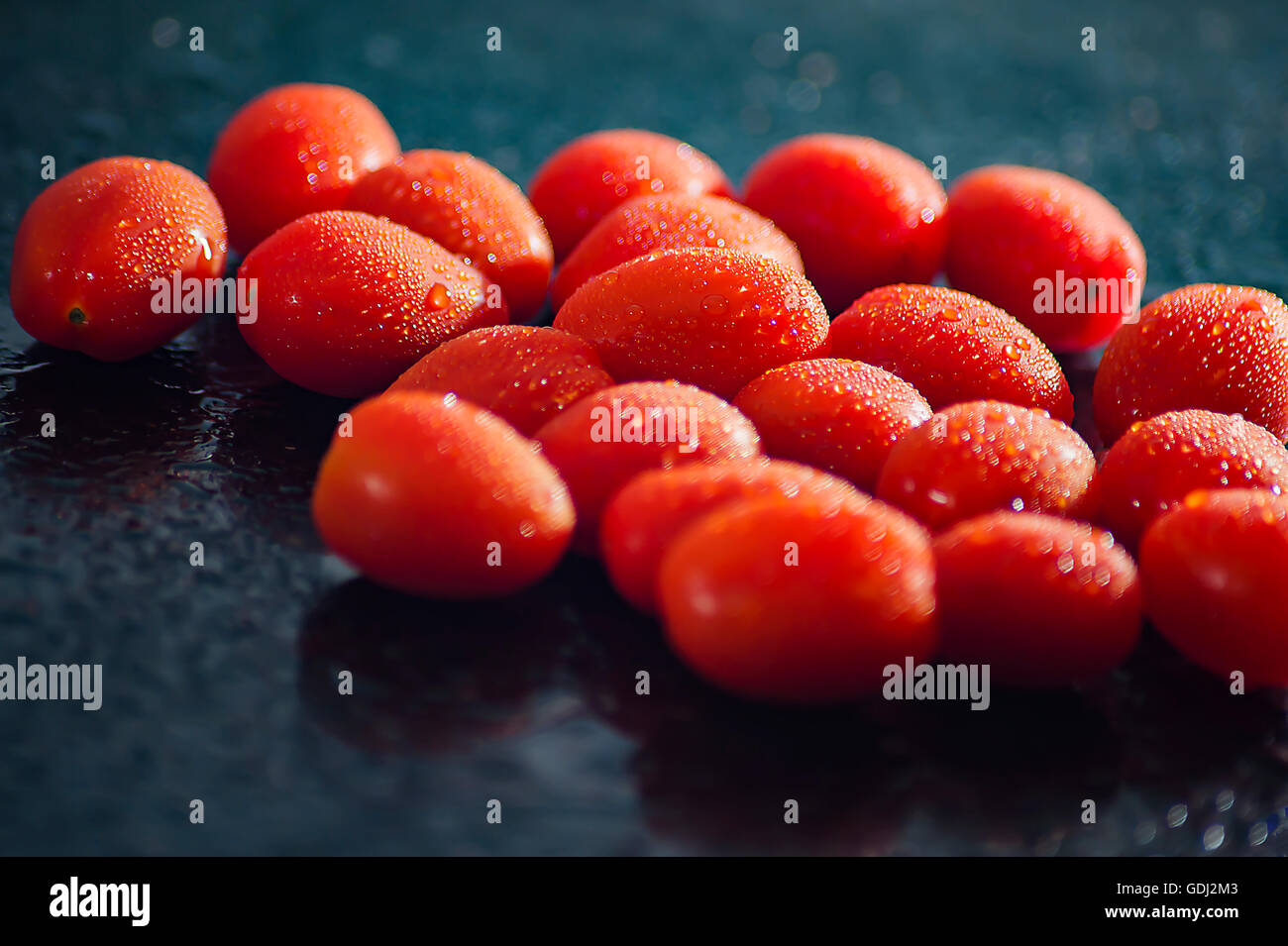 Red mini plum tomatoes hi-res stock photography and images - Alamy
