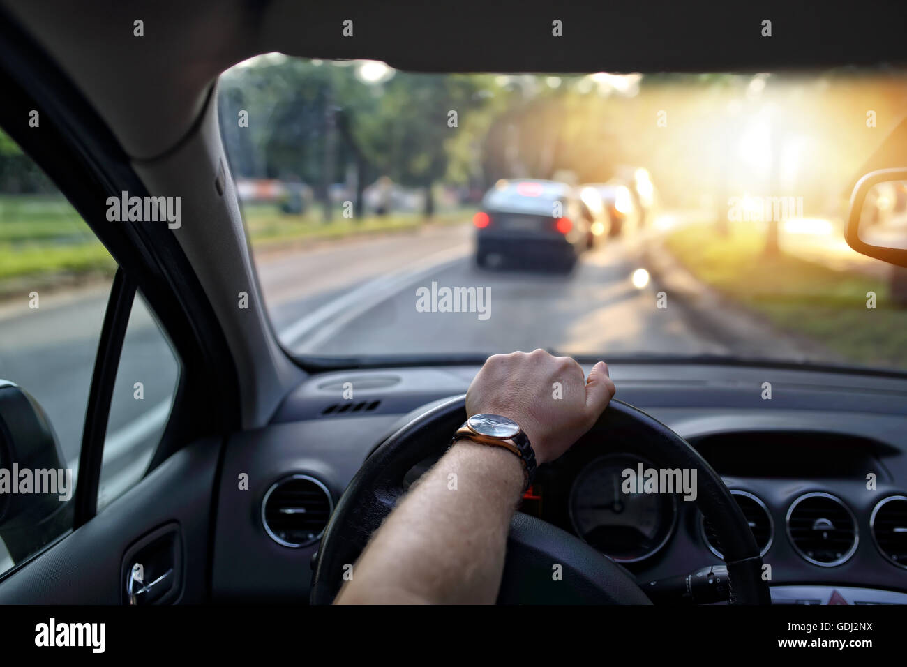 car going down the street Stock Photo - Alamy