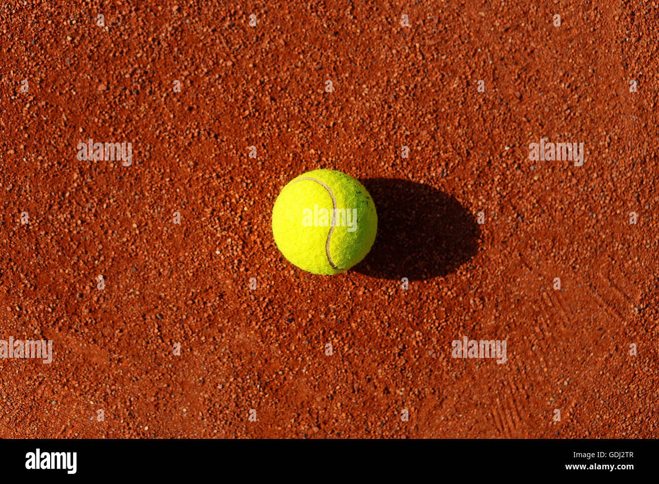 tennis court with tennis ball and antuka background Stock Photo - Alamy