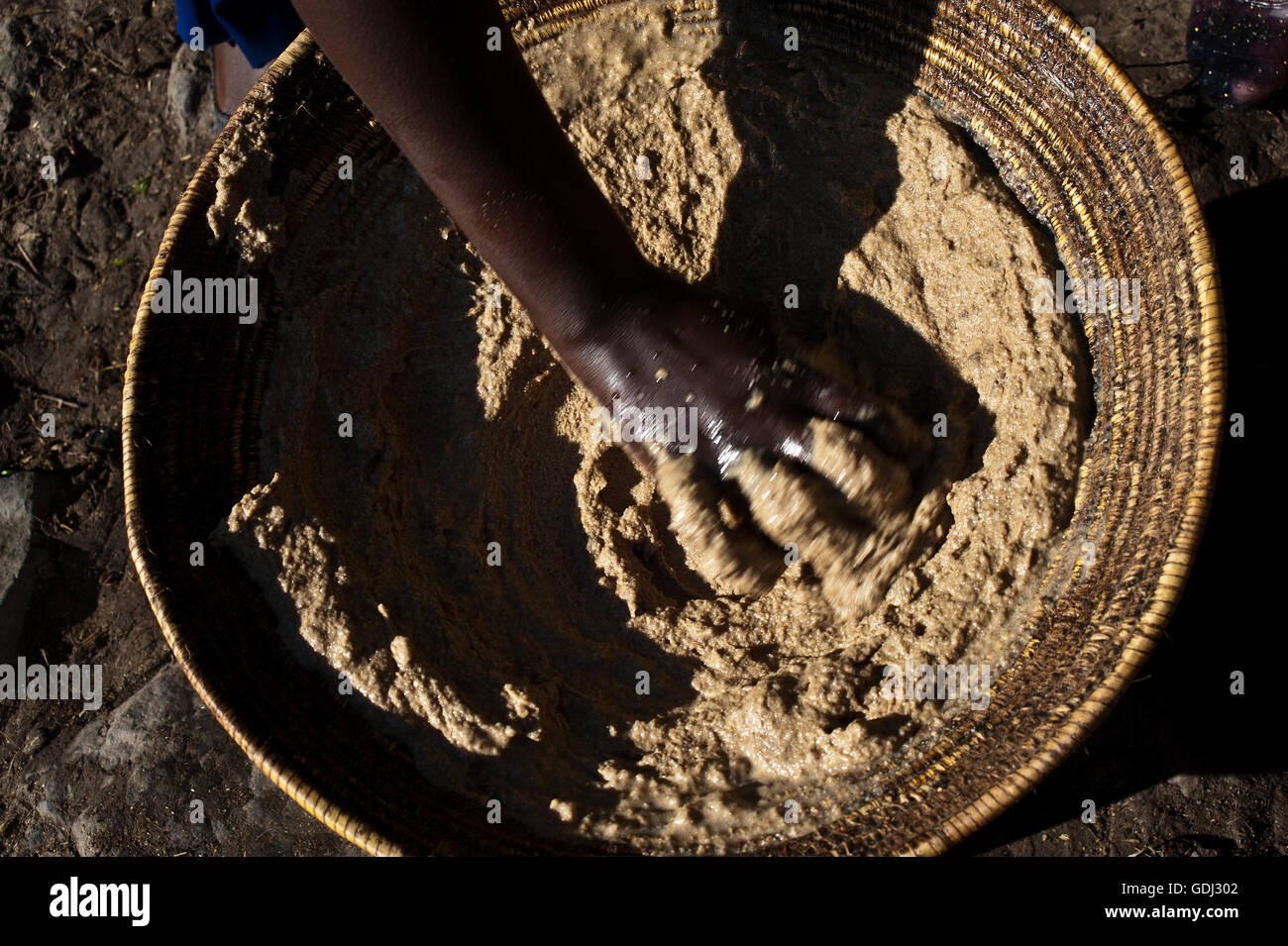 Hands of a woman preparing local alcohol made of sorghum ( Ethiopia ...