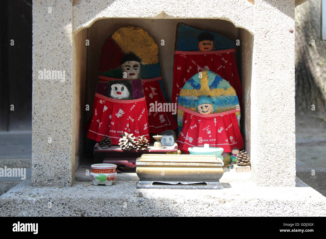 Exterior stone altar with statues of divinities in the Chion-ji temple ...