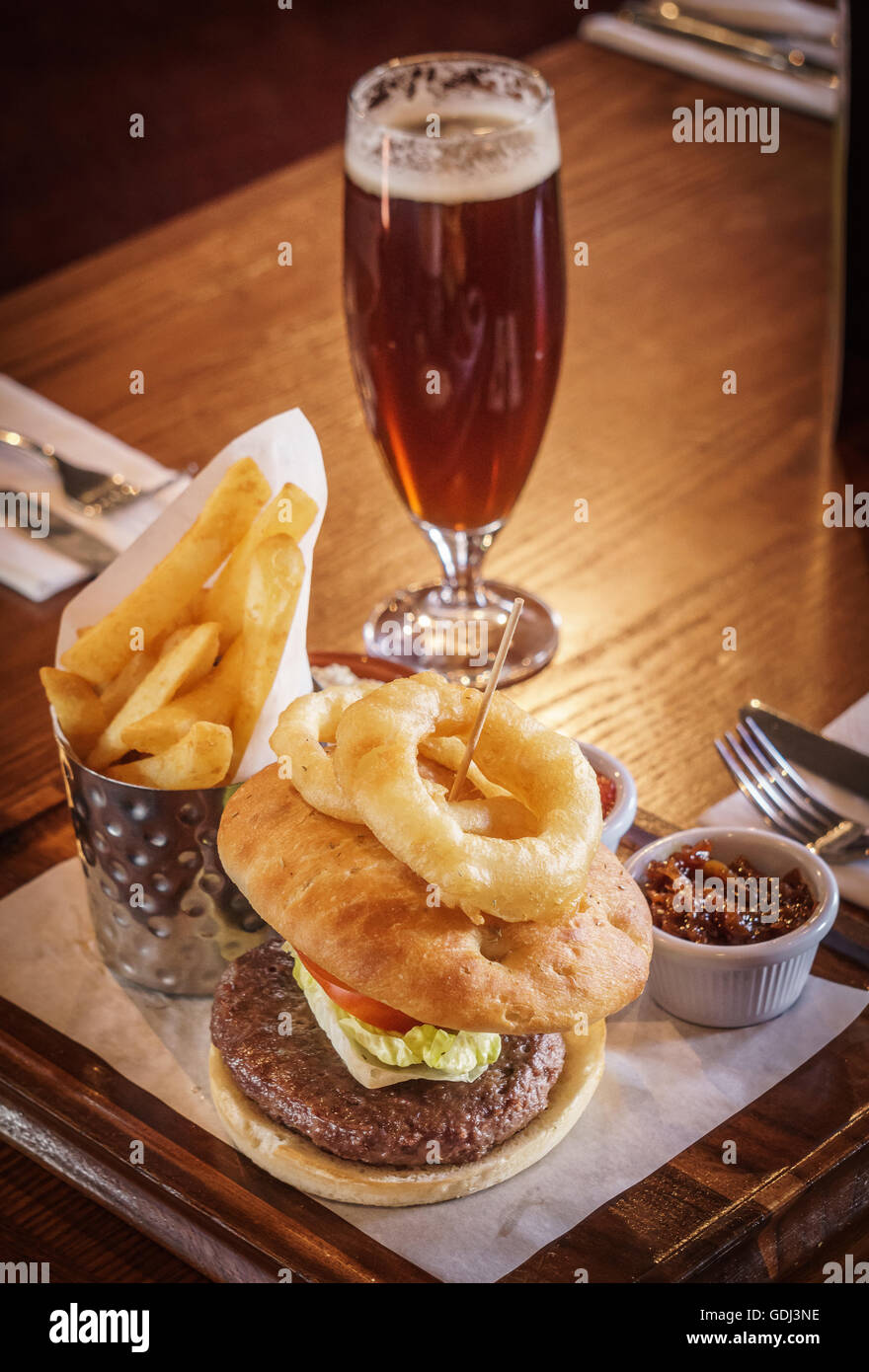 Fresh Scottish burger with onion rings and garnish Stock Photo - Alamy