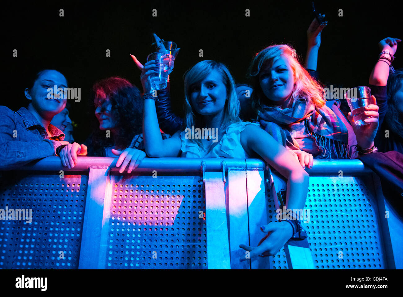 Girls in the first row at rock concert at night posing @ Zagreb ...