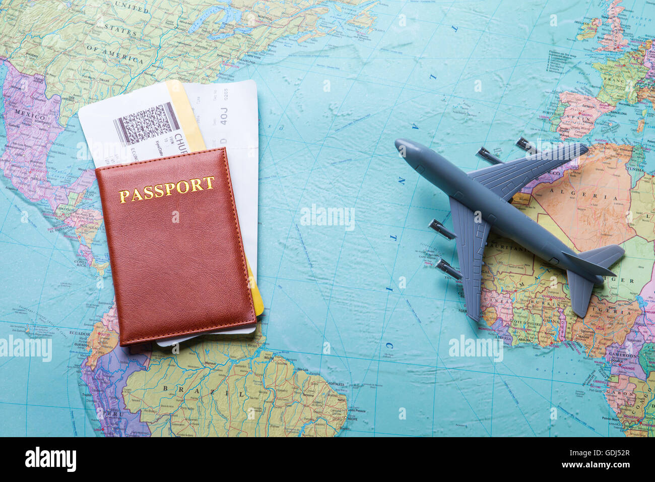 Passport with tickets on map Stock Photo - Alamy