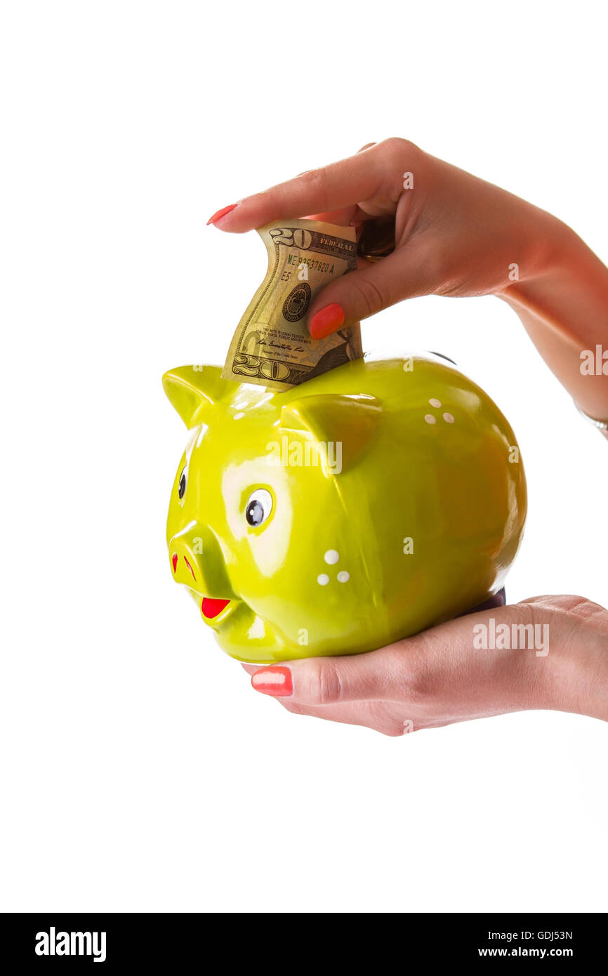 Girl's hand holding money box Stock Photo - Alamy