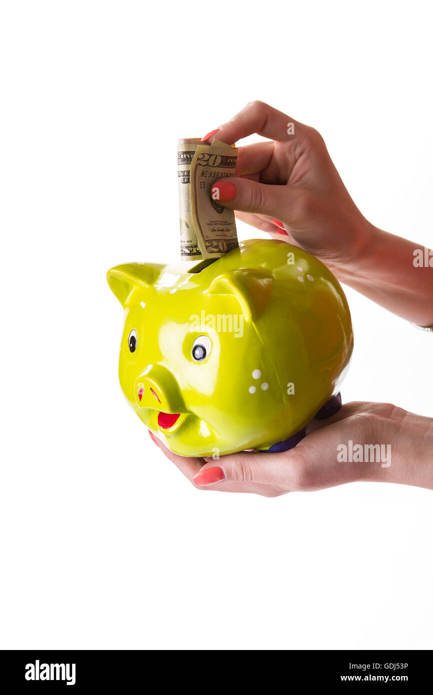 Girl's hand holds money box Stock Photo - Alamy