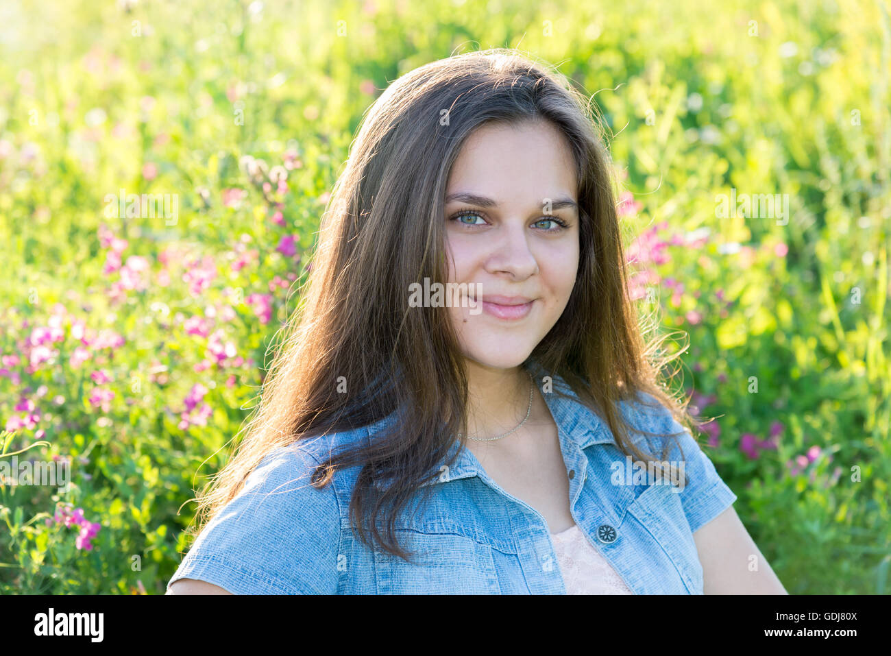 Portrait of girl of 16 years in flower meadow Stock Photo - Alamy