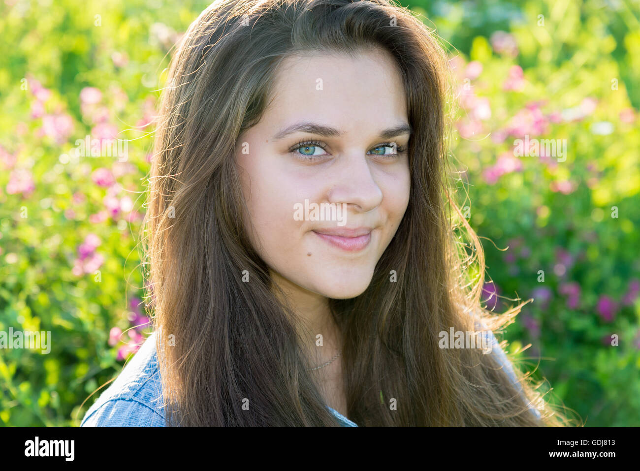 Portrait of a teenager 15 years with long hair in meadow Stock Photo ...