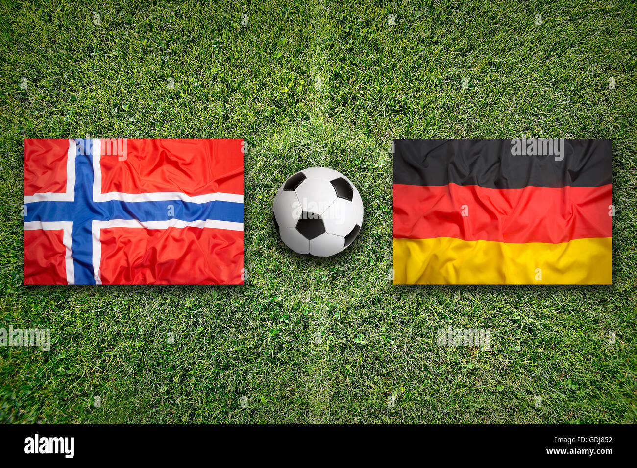 Norway vs. Germany flags on green soccer field Stock Photo - Alamy