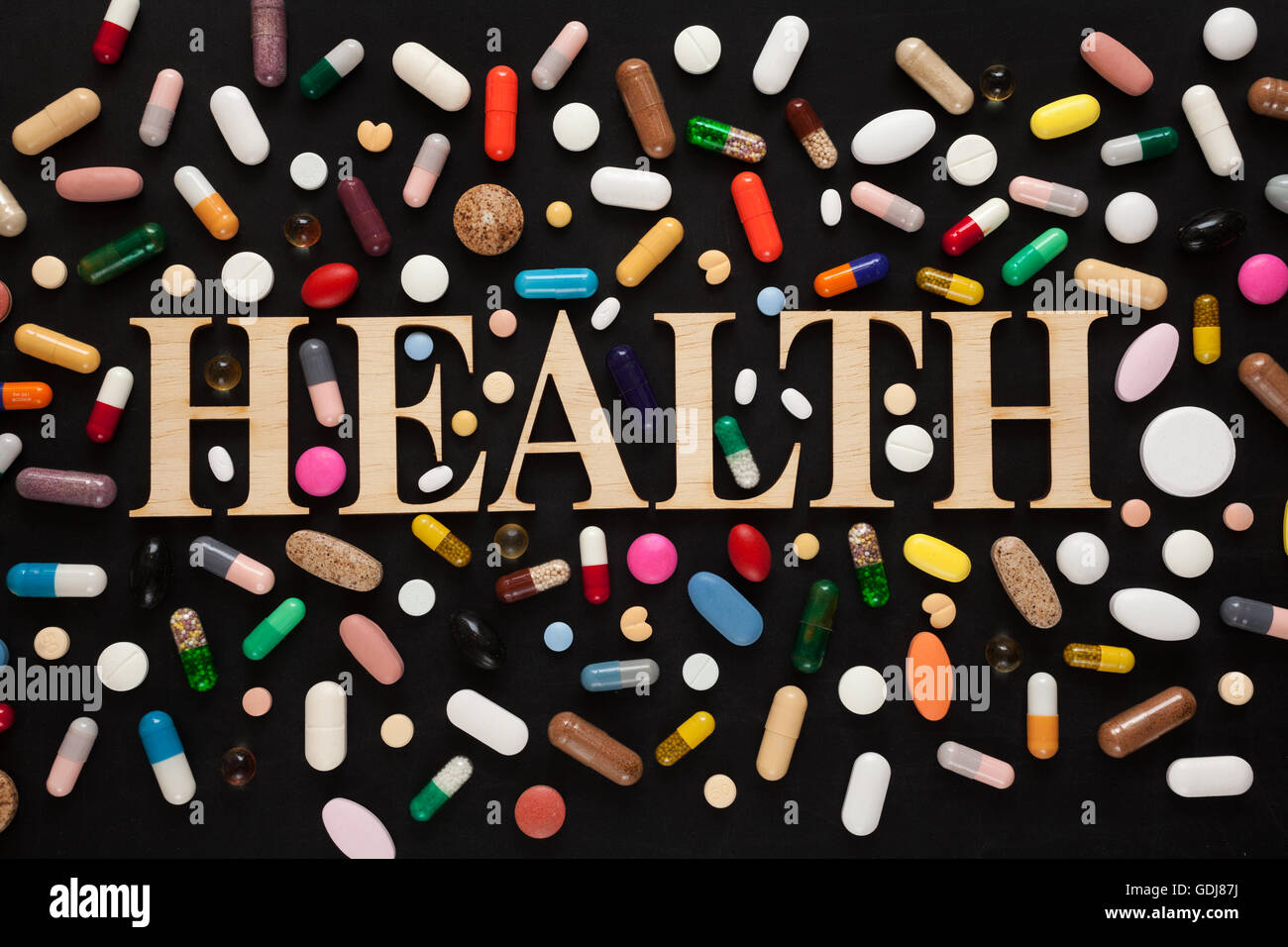 Word HEALTH with wooden letters surrounded by colorful pills Stock ...