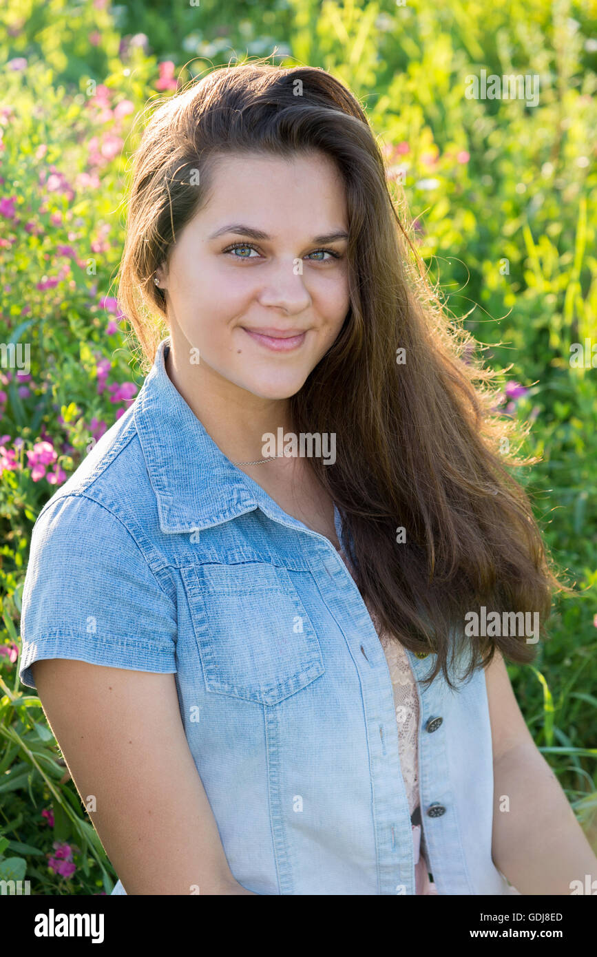 Portrait of a teenager 15 years with long hair in meadow Stock Photo ...