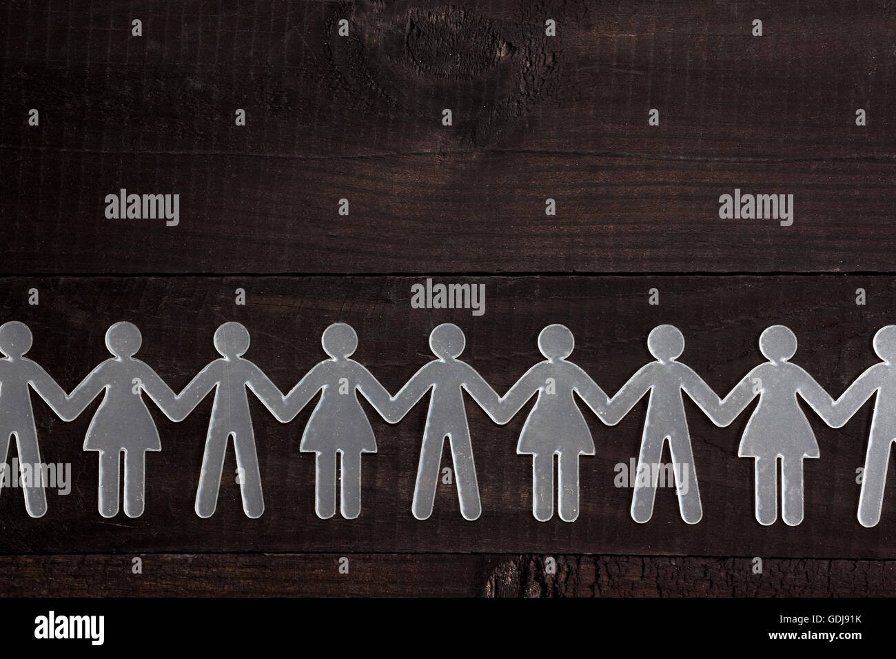 Human chain on black background Stock Photo - Alamy