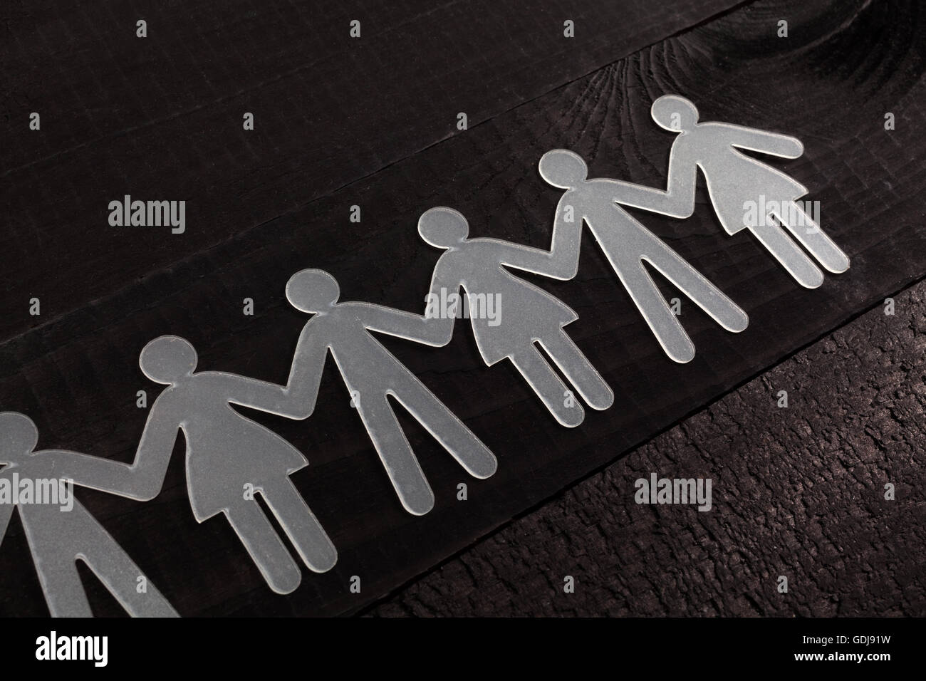 Human chain on black background Stock Photo - Alamy