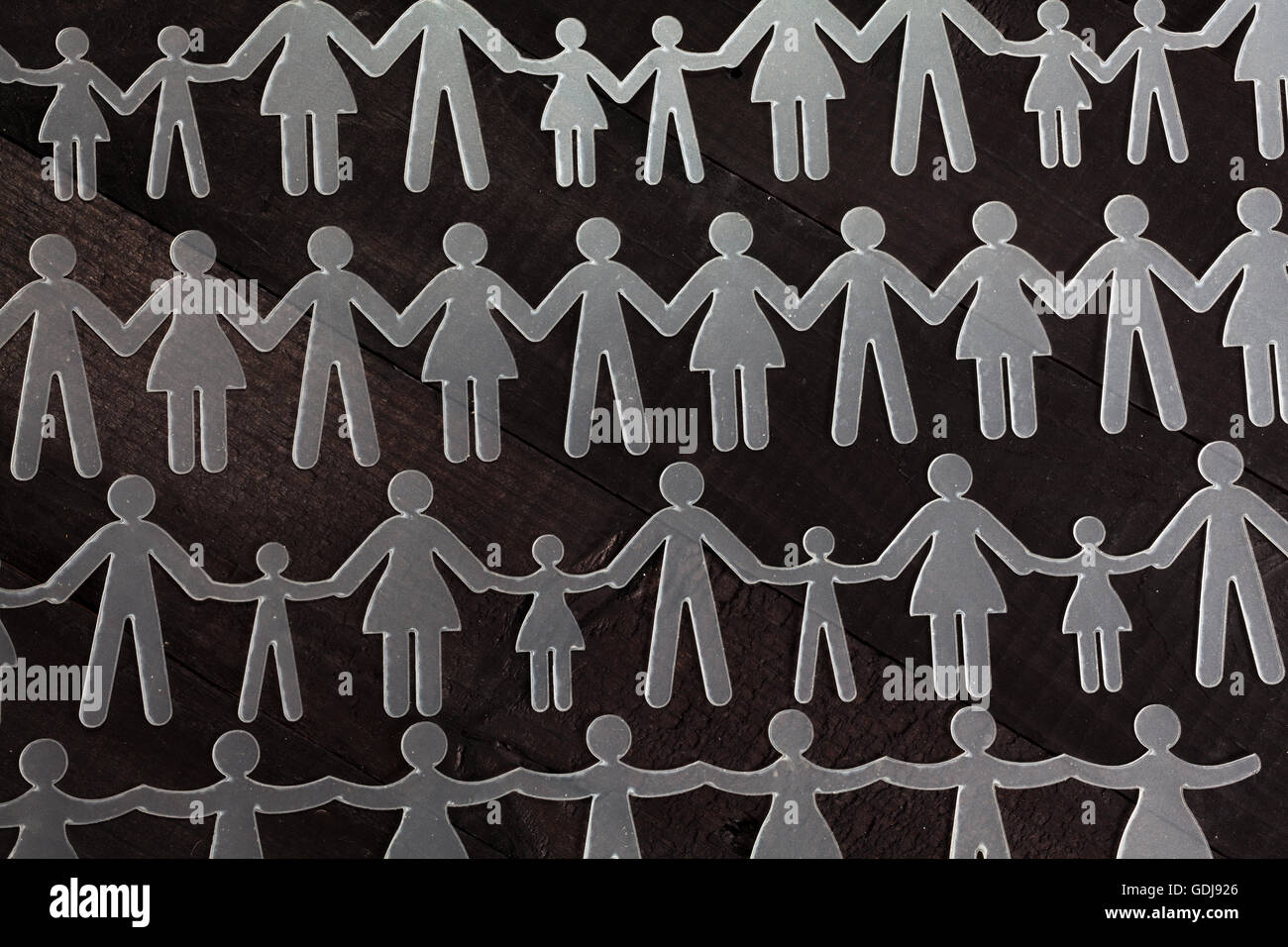 Human chain on black background Stock Photo - Alamy