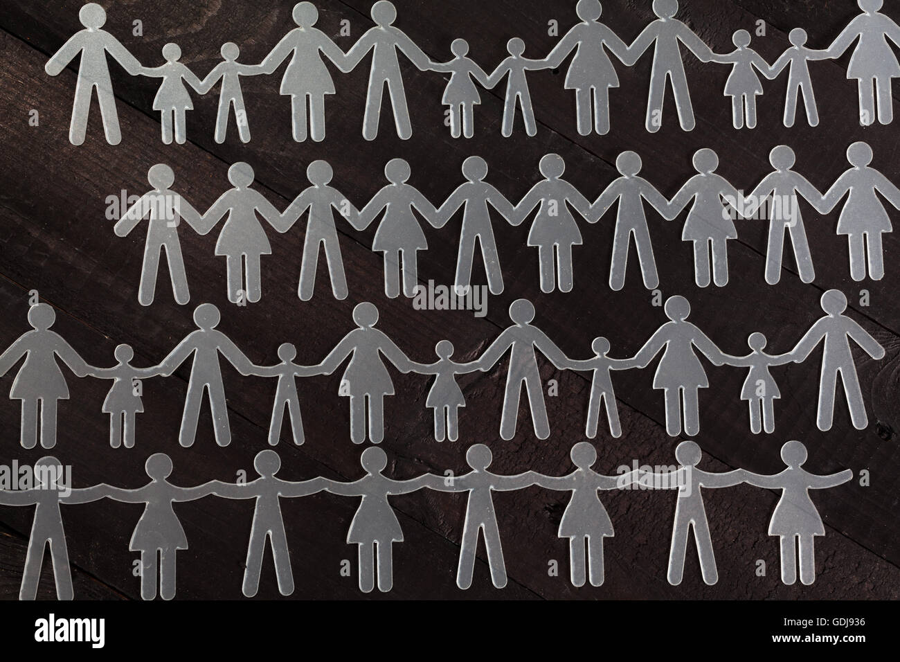 Human chain on black background Stock Photo - Alamy