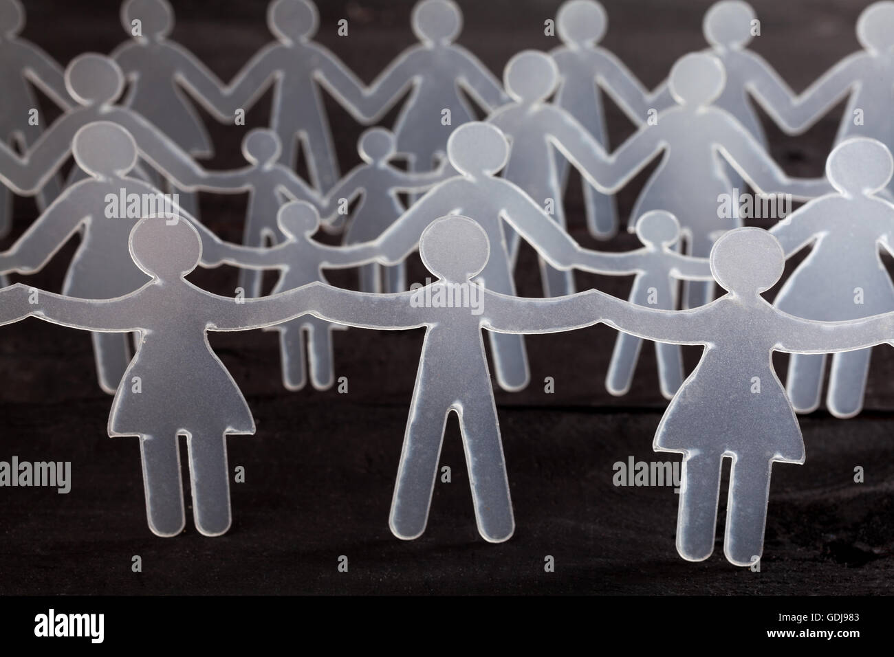 Human chain on black background Stock Photo - Alamy