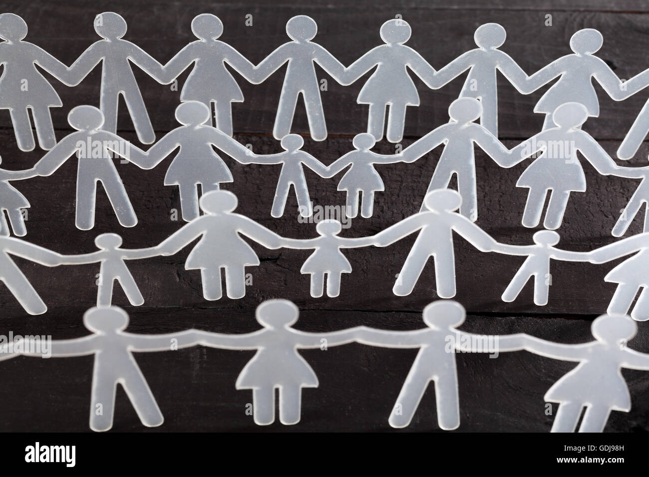 Human chain on black background Stock Photo - Alamy