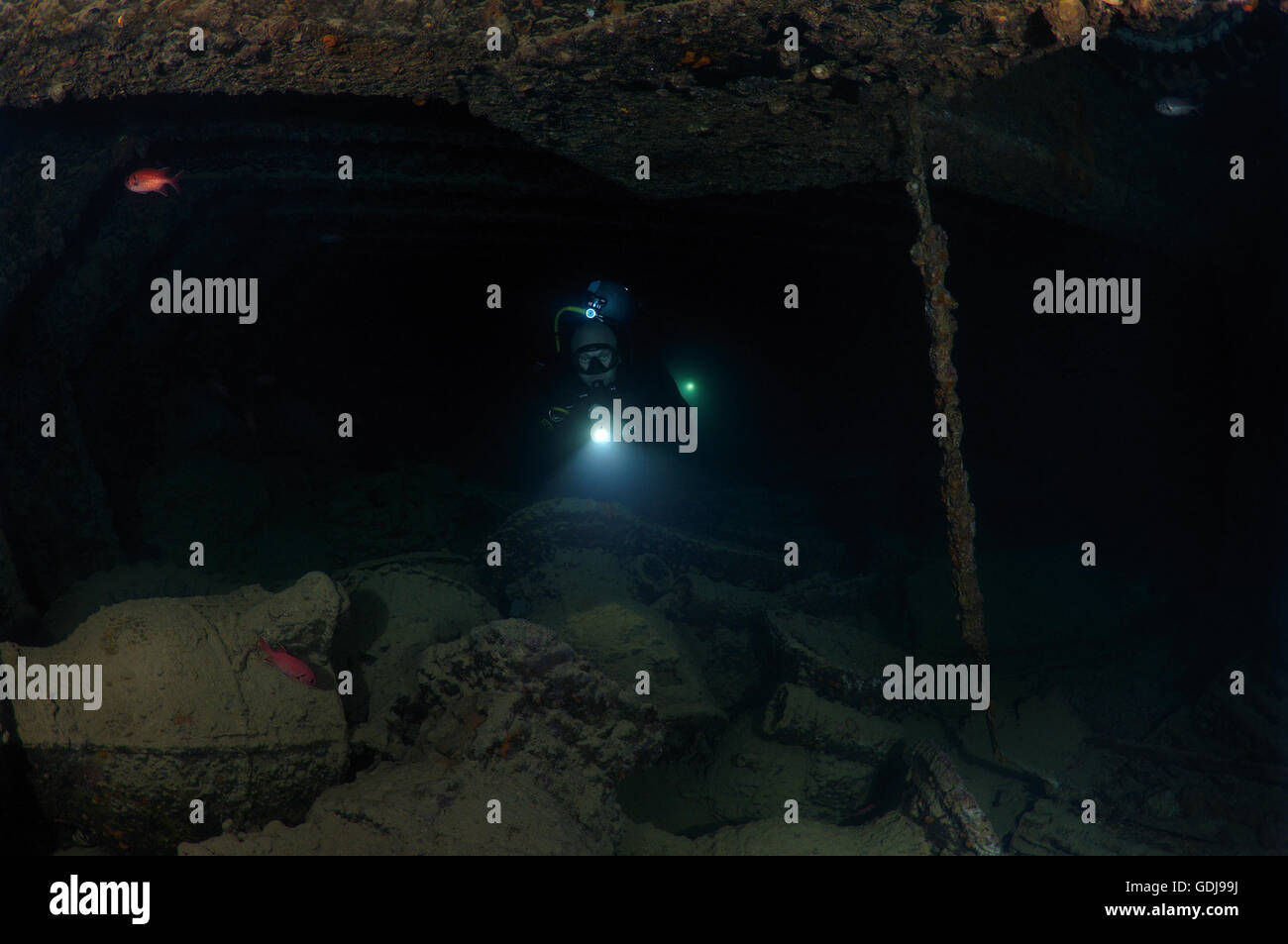 Male scuba diver inside the wreck of the SS Thistlegorm (British armed ...