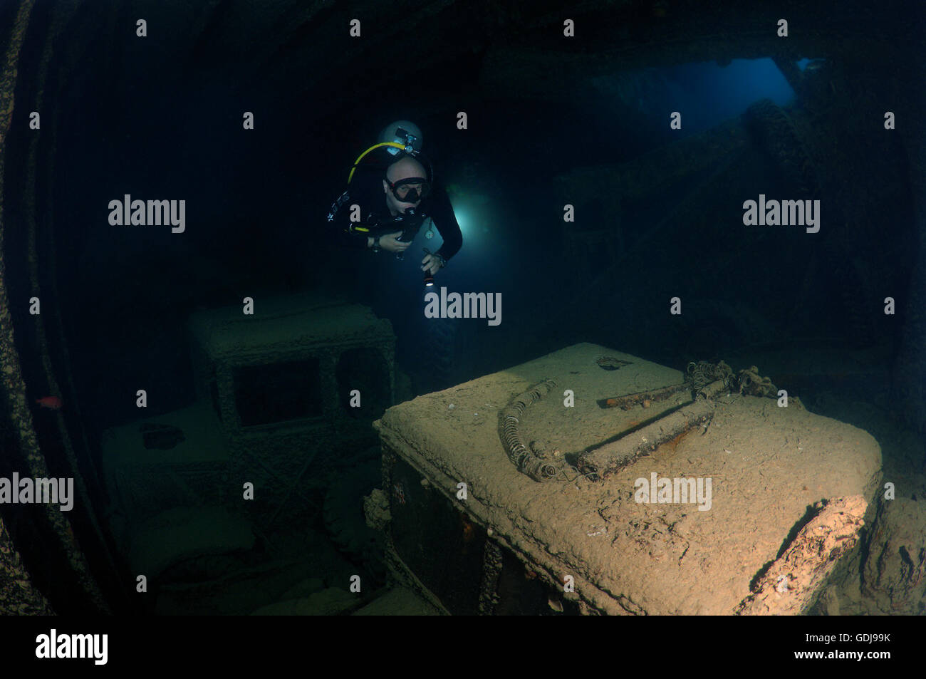 Male scuba diver at truck inside the wreck of the SS Thistlegorm ...