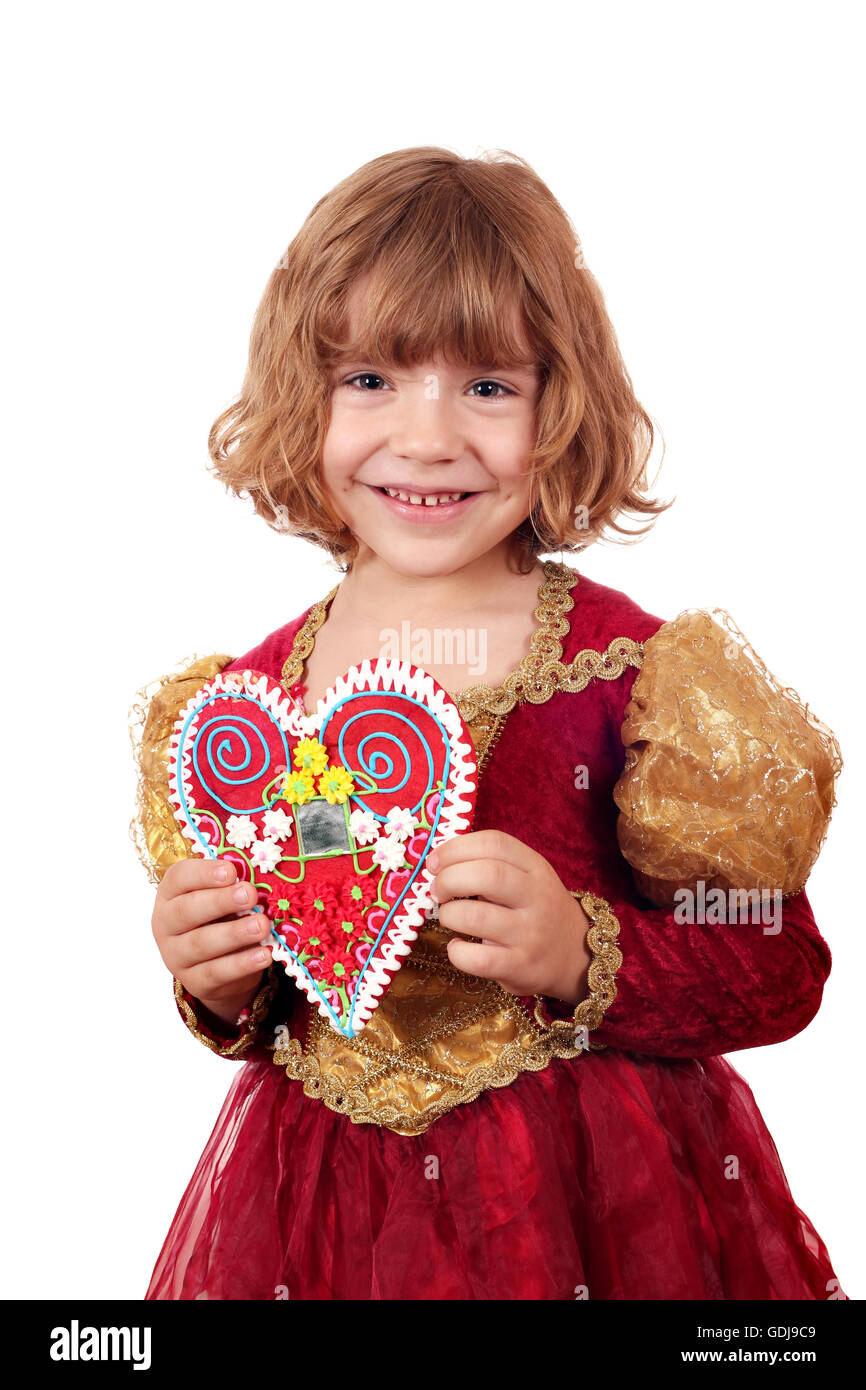 beautiful little girl holding gingerbread heart Stock Photo - Alamy