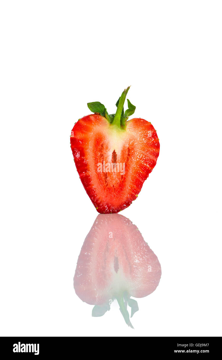 A halved strawberry with reflection on white background Stock Photo - Alamy