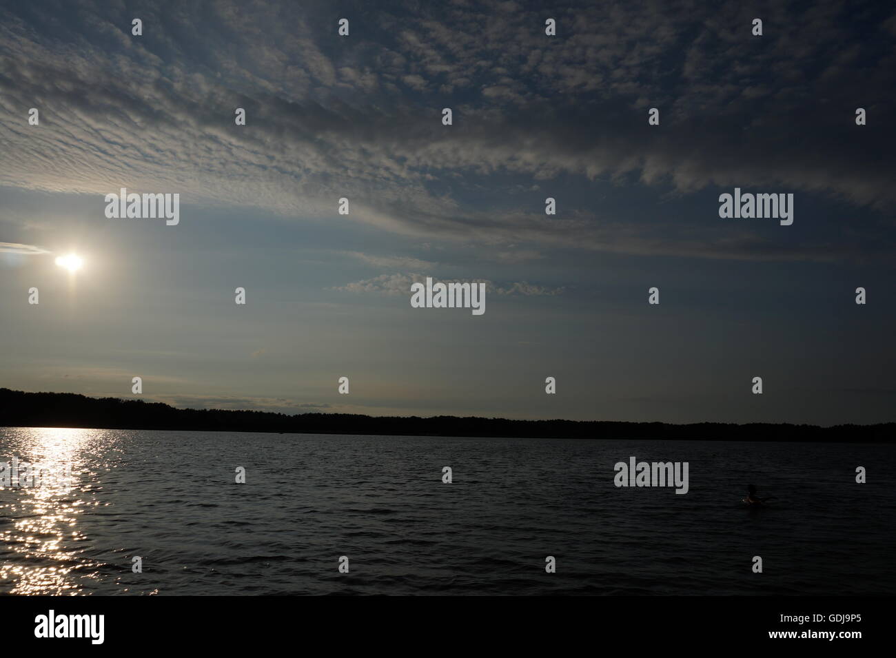 Beautiful sunset at the beach, amazing colors, light beam shining ...